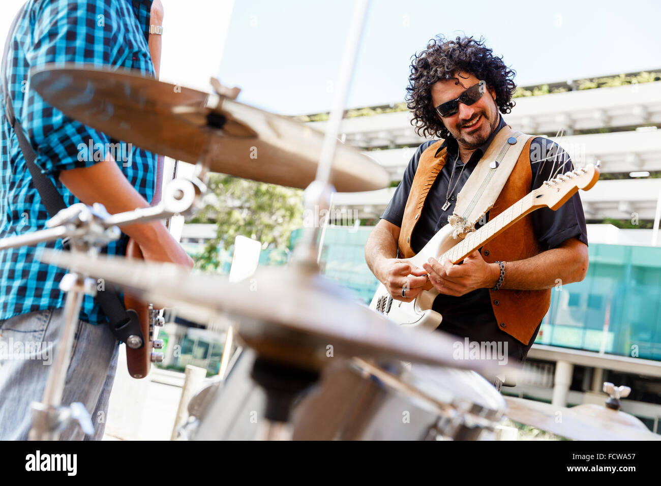 Band of musicians playing in the street Stock Photo - Alamy
