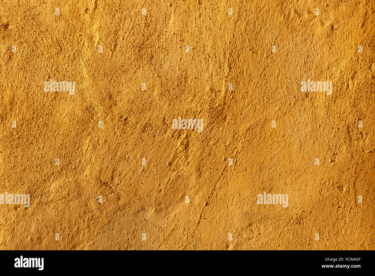 Yellow stucco wall. Background texture Stock Photo - Alamy