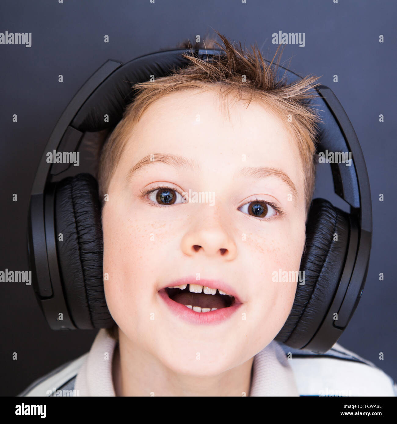 Boy singing headphones hi-res stock photography and images - Alamy