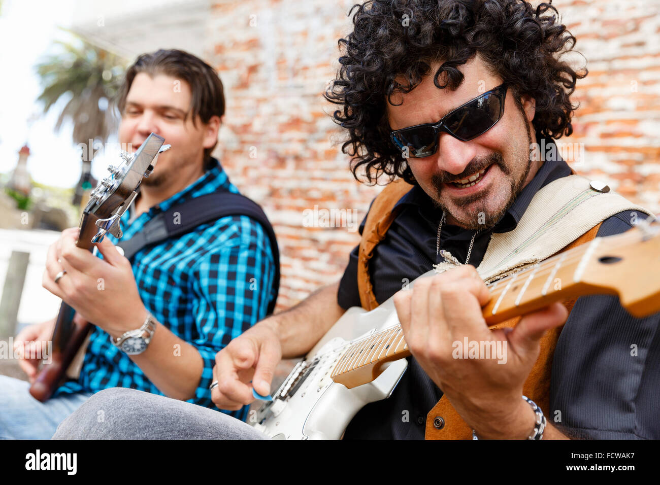 Band of musicians playing in the street Stock Photo - Alamy
