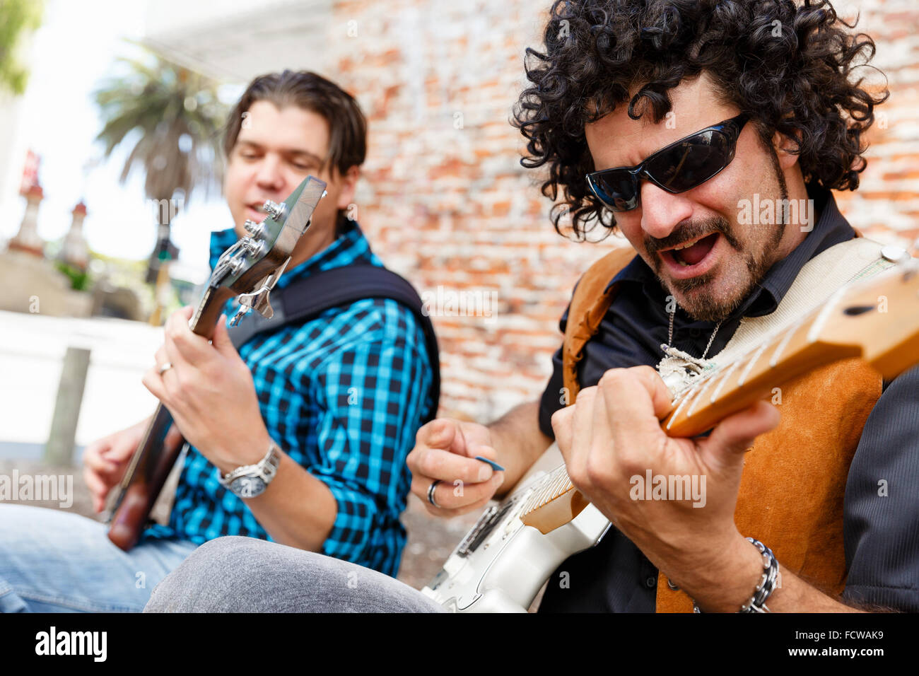 Band of musicians playing in the street Stock Photo - Alamy
