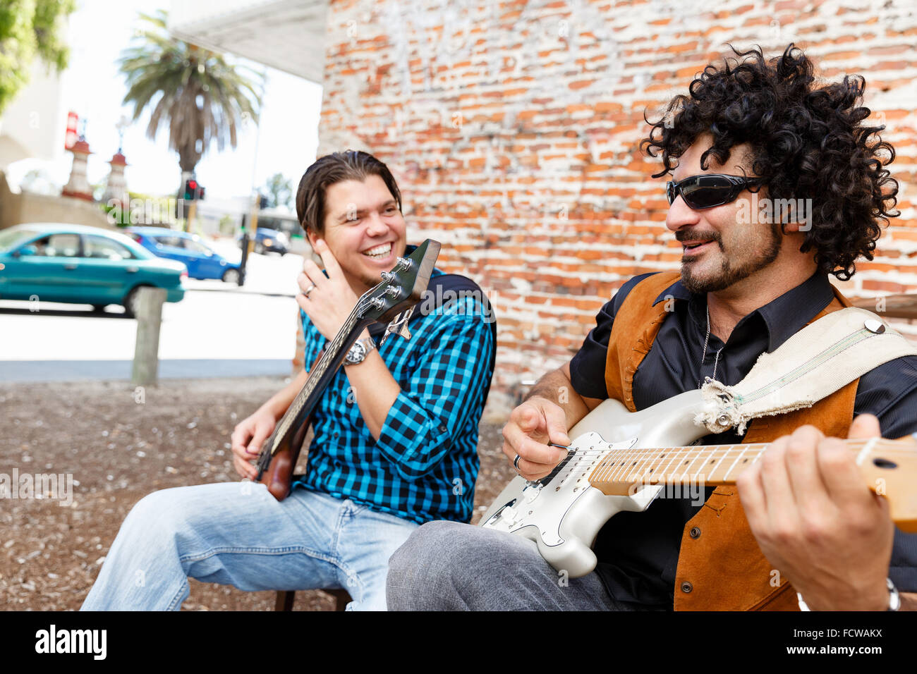 Band of musicians playing in the street Stock Photo - Alamy