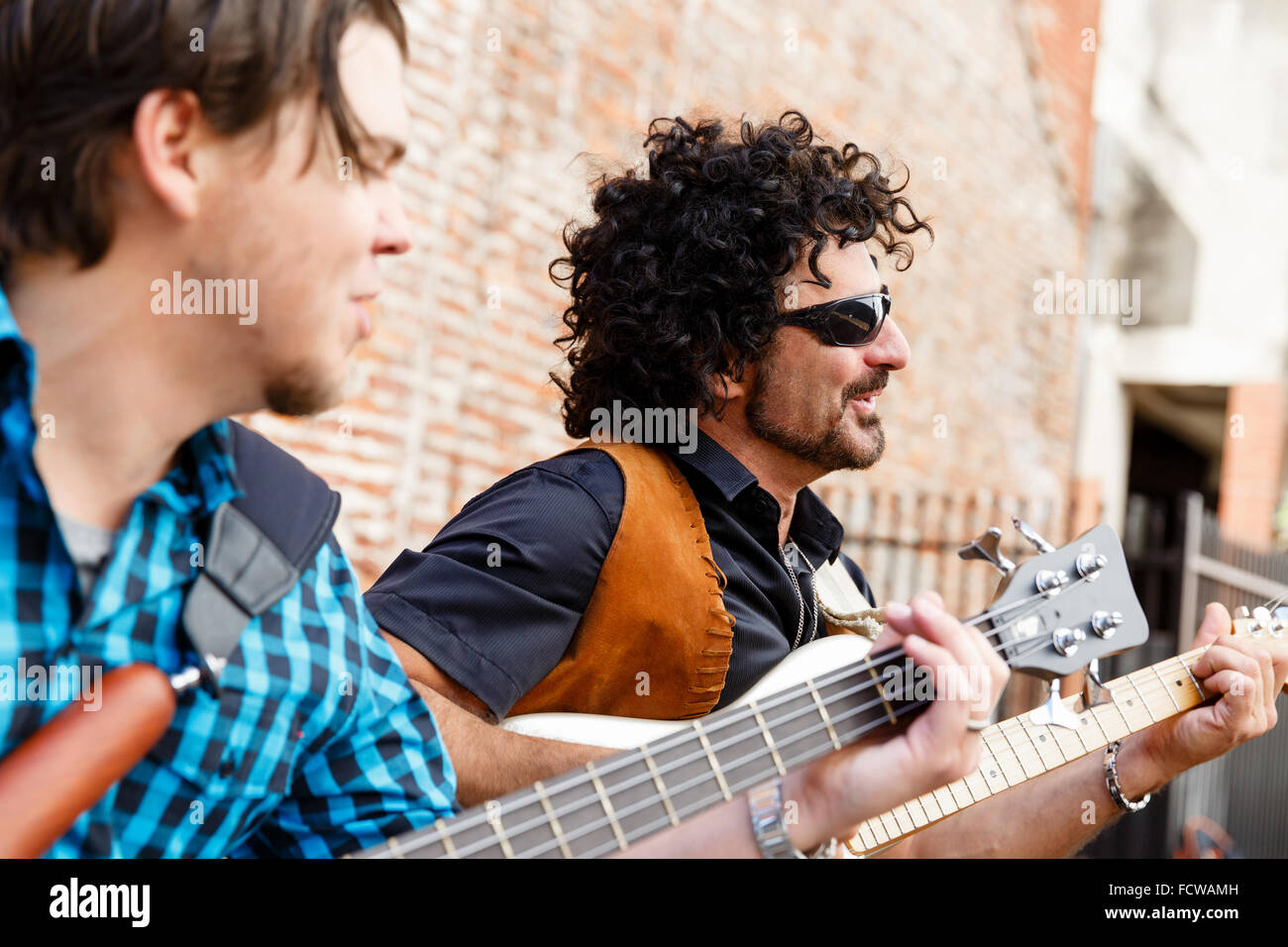 Band of musicians playing in the street Stock Photo - Alamy