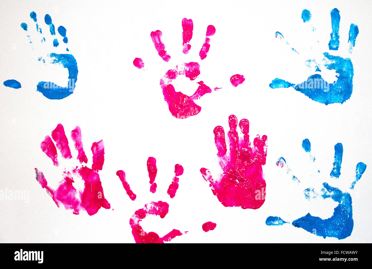 Fuchsia and blue finger painted hands Stock Photo - Alamy