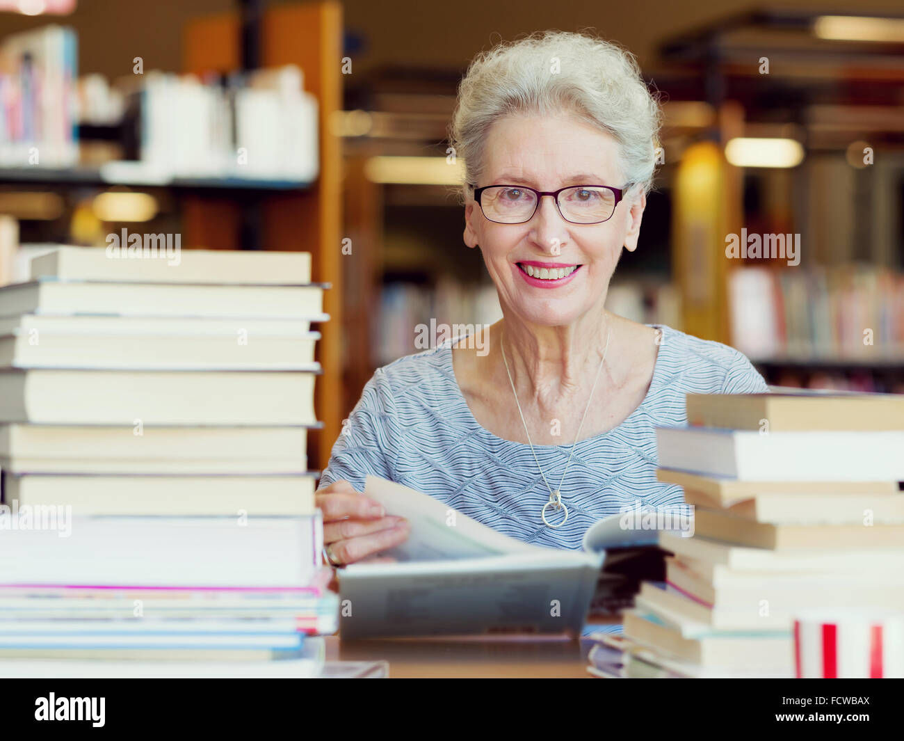 Elderly scholar holding hi-res stock photography and images - Alamy