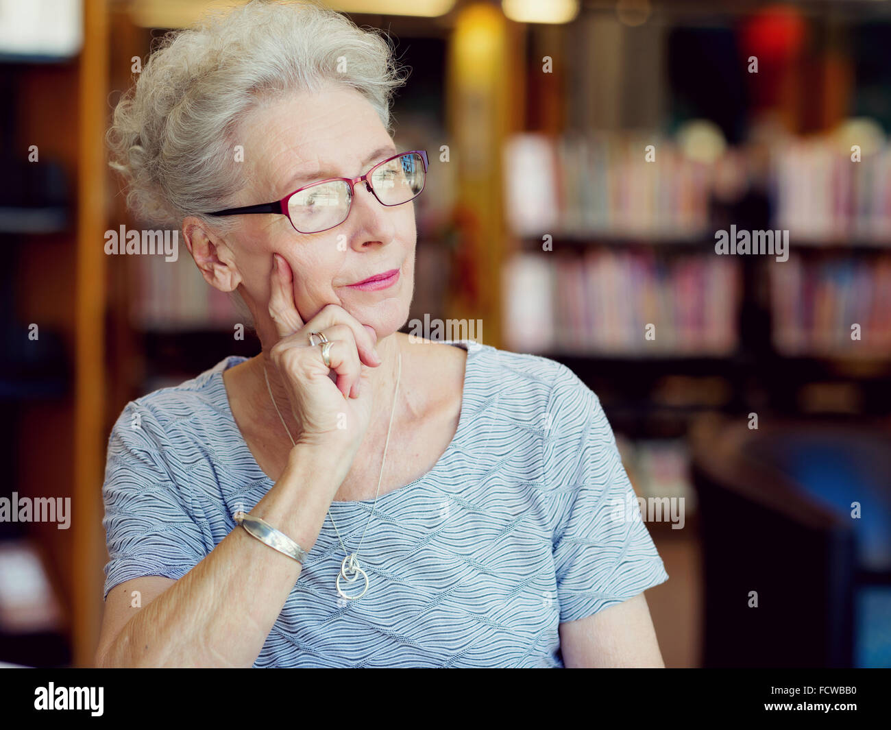 Portrait of elderly lady thinking something Stock Photo - Alamy