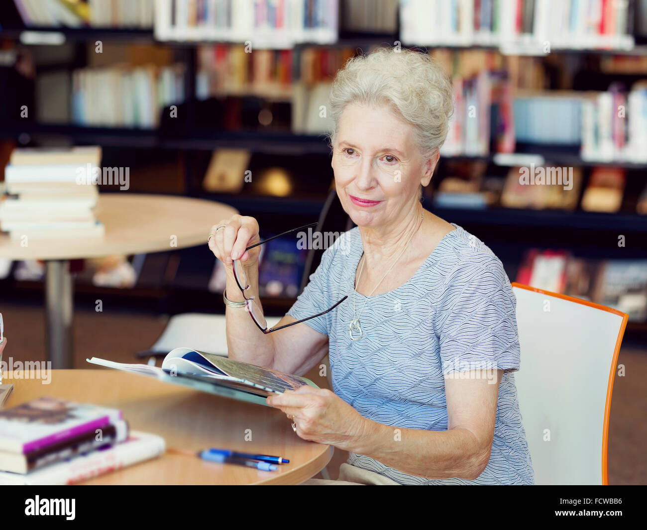 Elderly scholar holding hi-res stock photography and images - Alamy