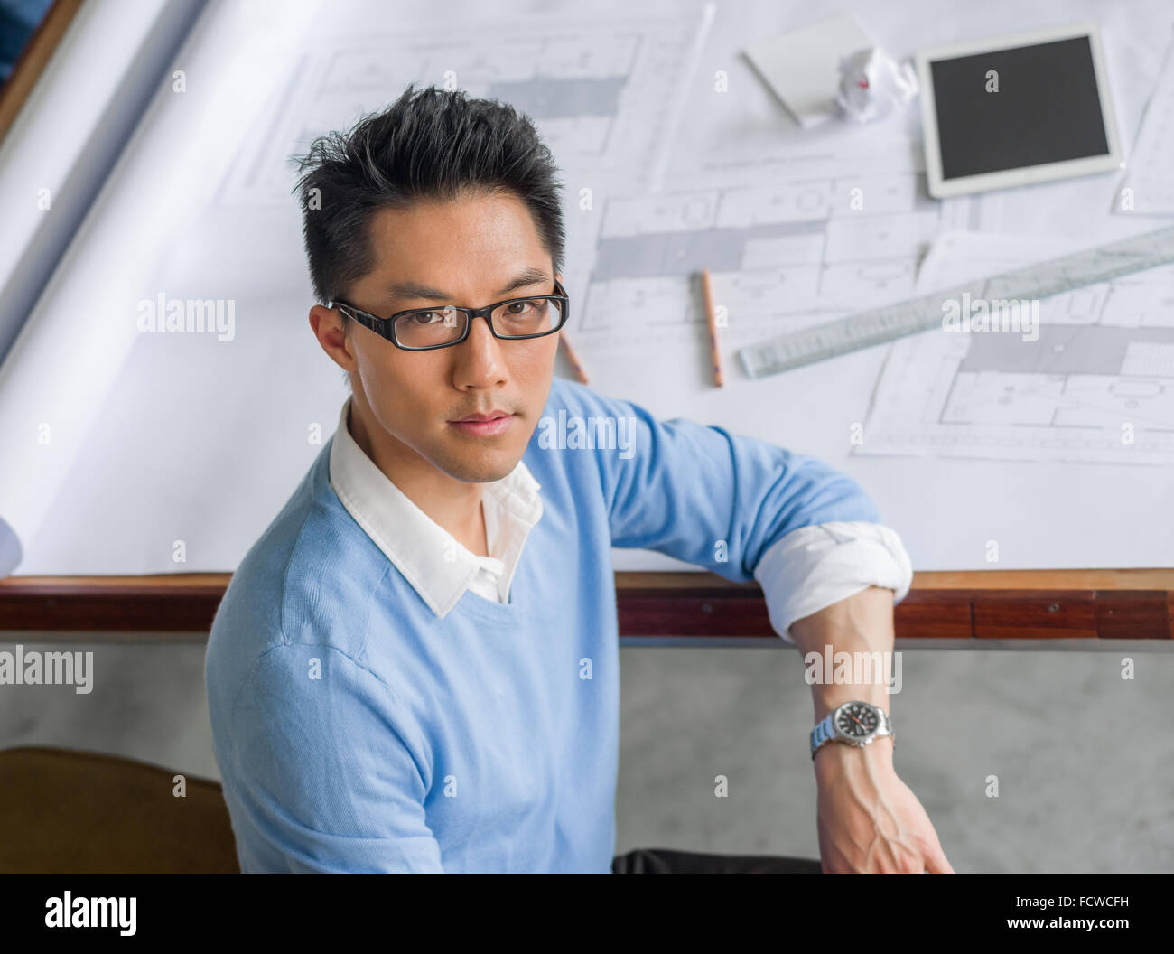 Young chineese engineer working in office Stock Photo - Alamy
