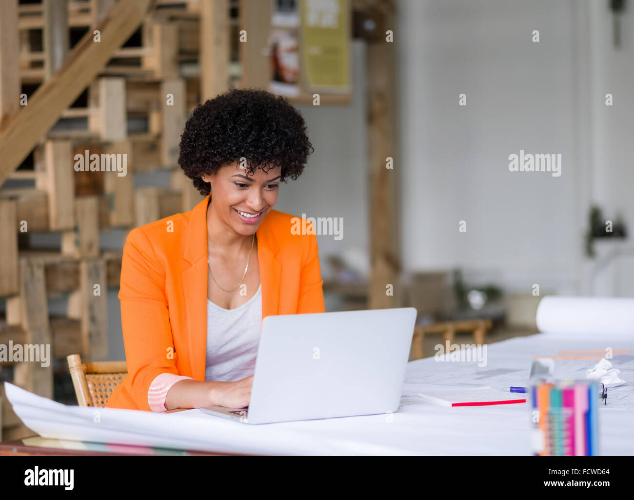 Young female engineer working in office Stock Photo - Alamy