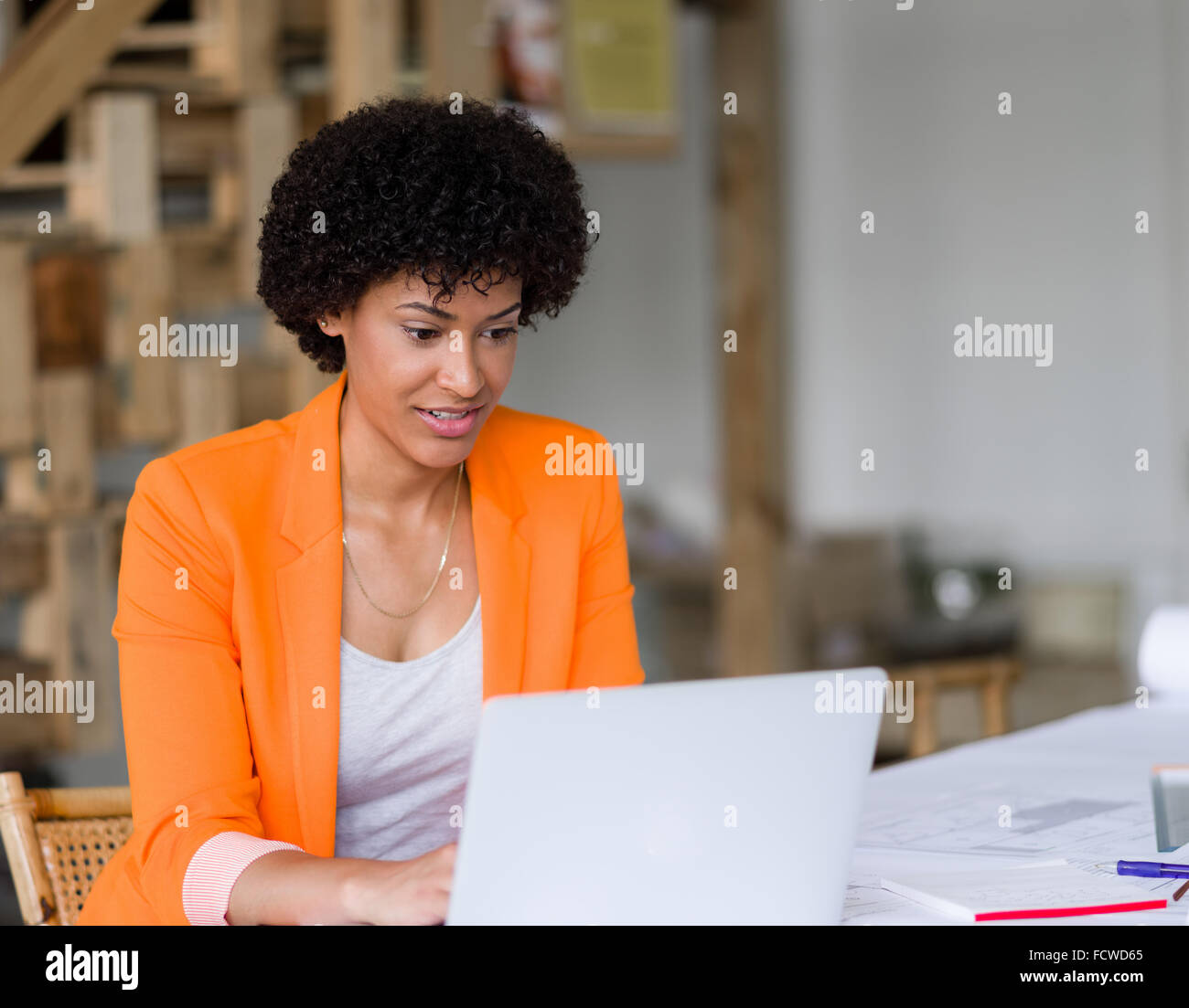Young female engineer working in office Stock Photo - Alamy