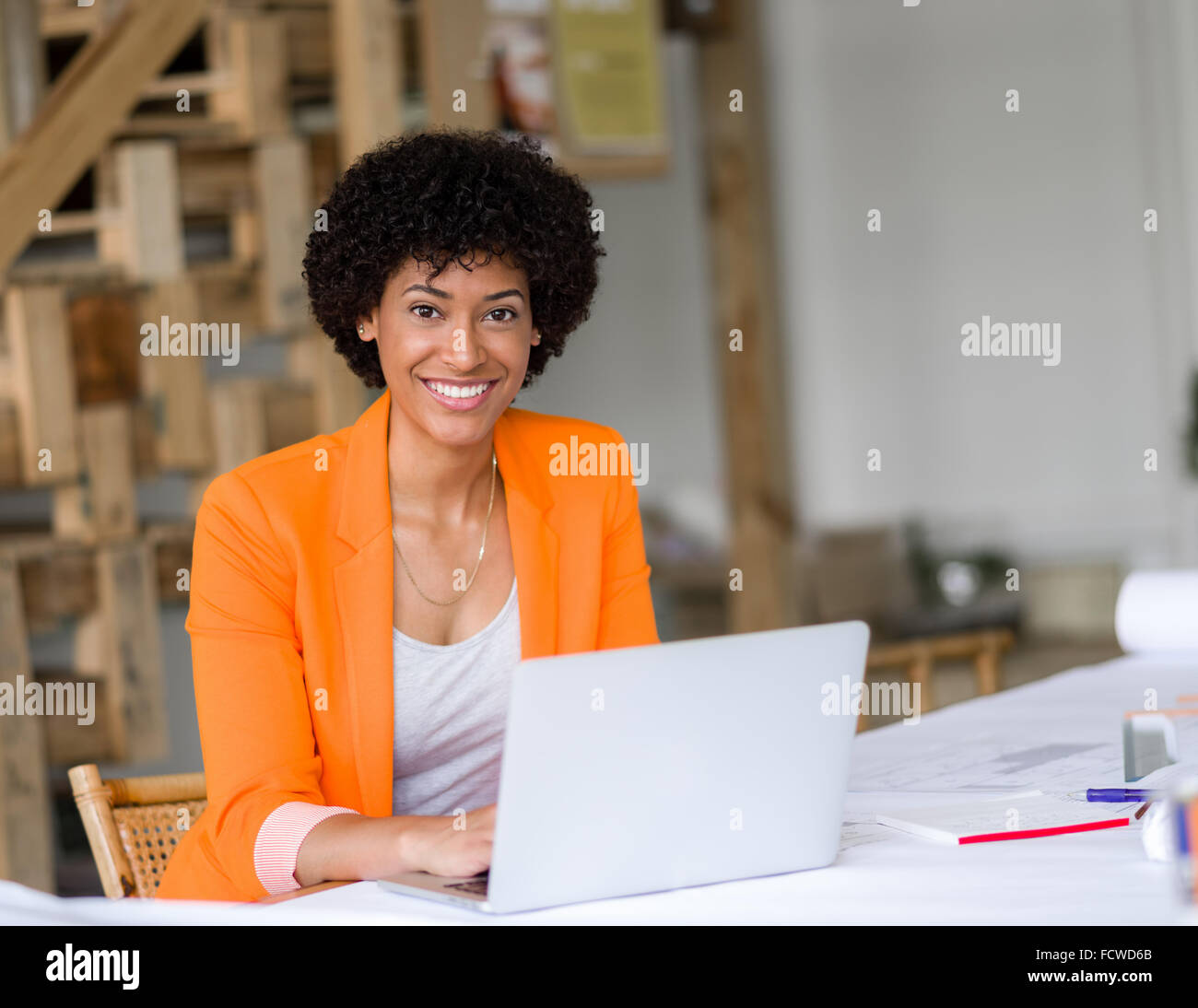 Young female engineer working in office Stock Photo - Alamy