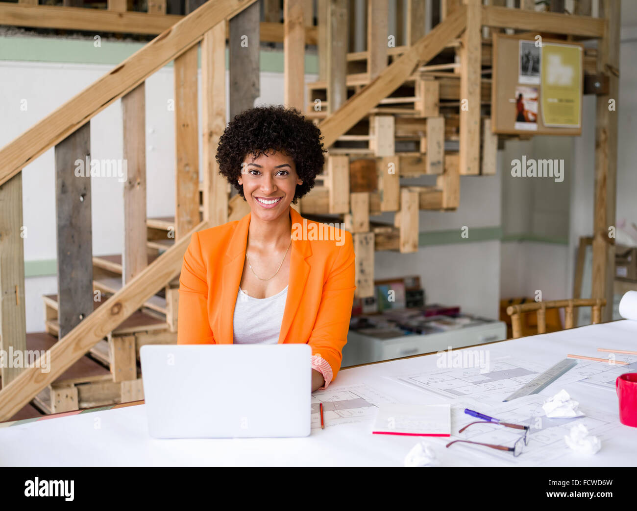 Young female engineer working in office Stock Photo - Alamy