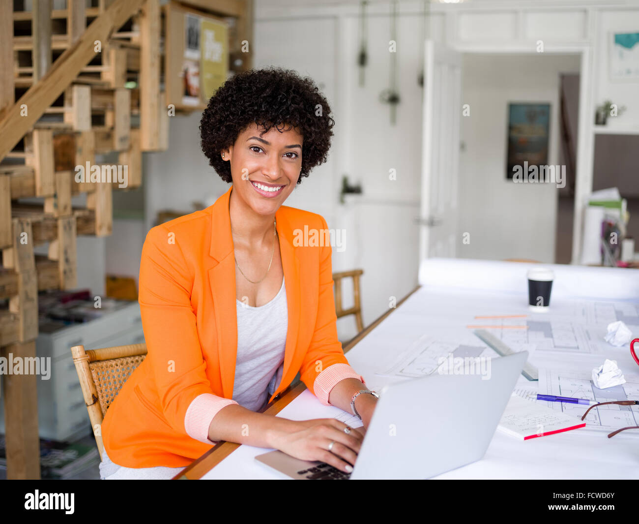Young female engineer working in office Stock Photo - Alamy