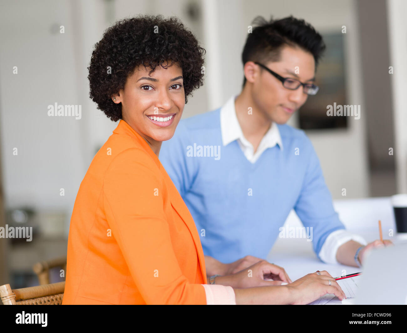 Two desingers working on a project together in office Stock Photo - Alamy