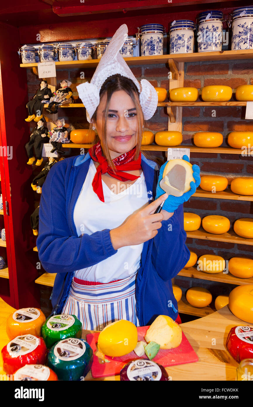 Female woman shop assistant in cheese shop wearing national dress ...