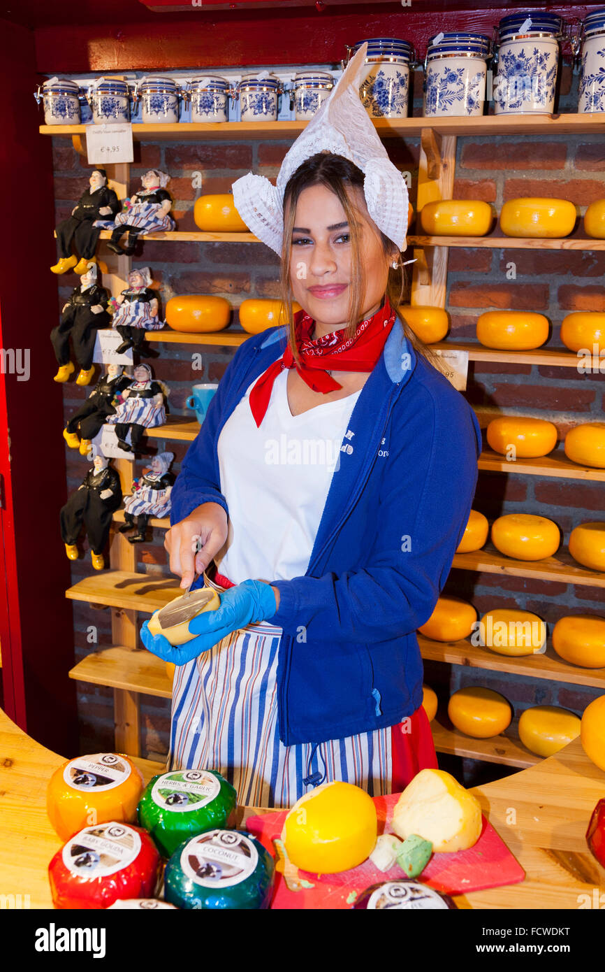 Female woman shop assistant in cheese shop wearing national dress ...