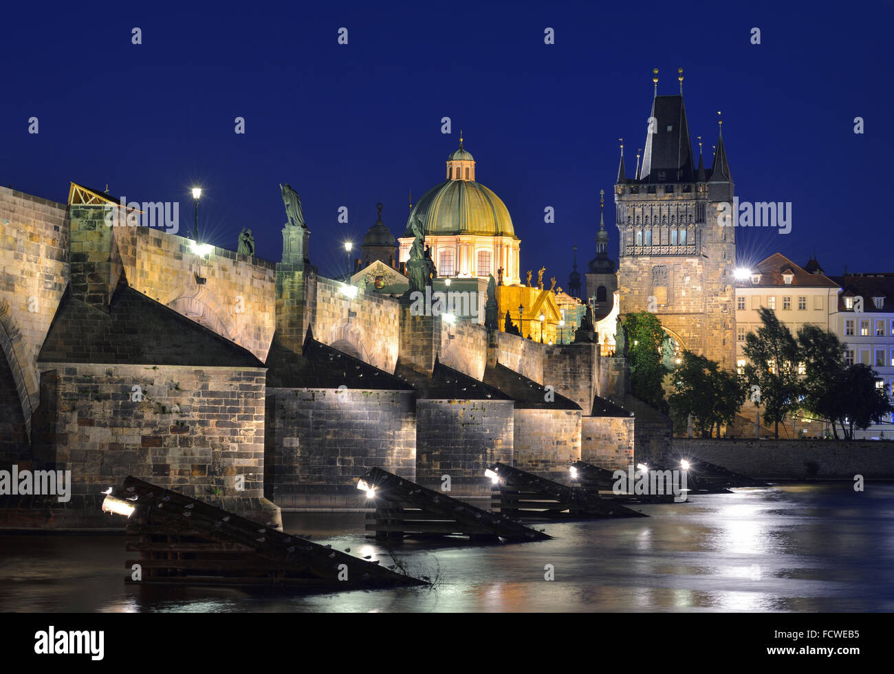 Vltava river, Charles Bridge and Old Town Bridge Tower in Prague at night. Karluv Most. Czech ...