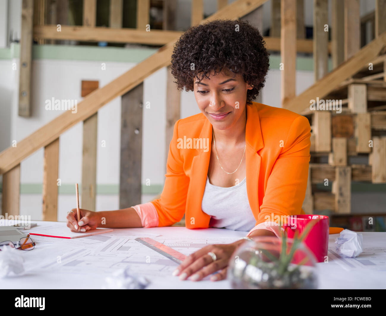 Young female engineer working in office Stock Photo - Alamy