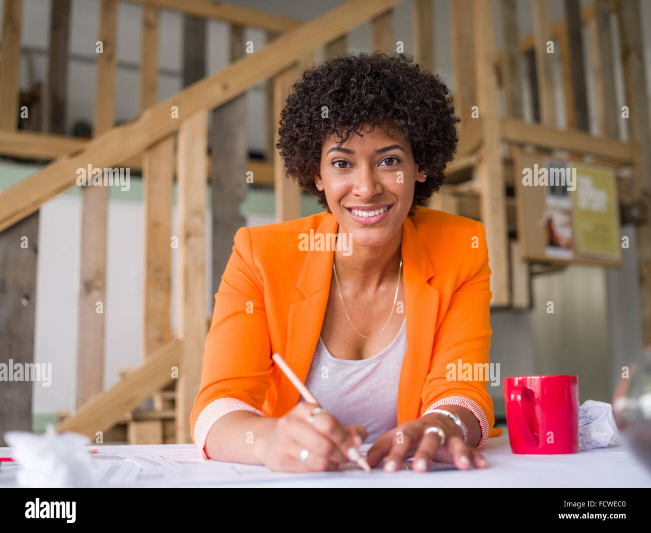 Young female engineer working in office Stock Photo - Alamy