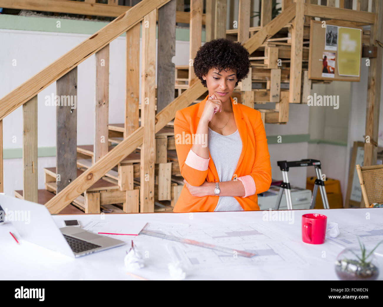 Young female engineer working in office Stock Photo - Alamy