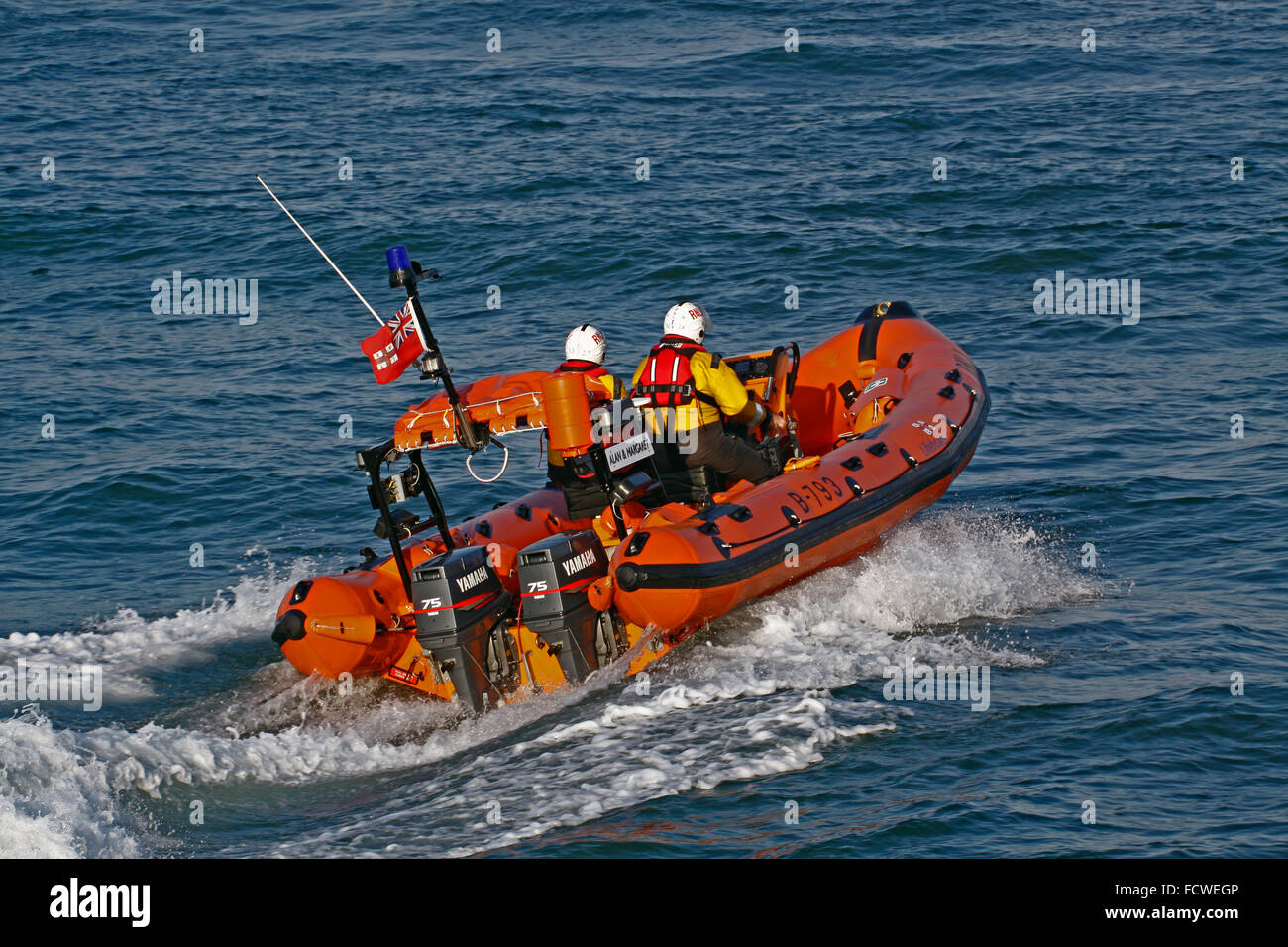 Looe RNLI's Atlantic 75 inshore lifeboat heading out into Looe bay with ...