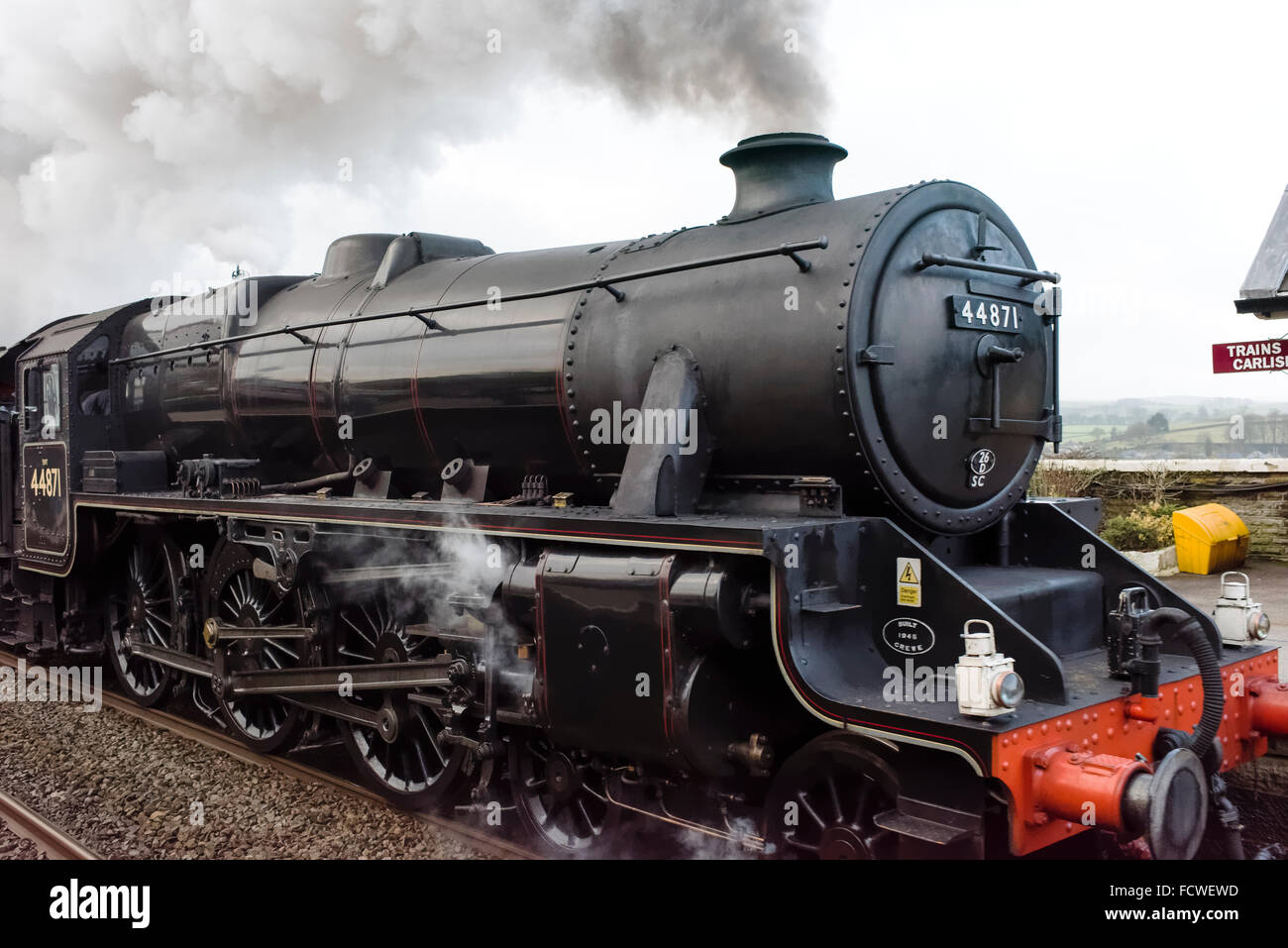 The LMS Class 5MT 4-6-0 44871 steam train speeding through Settle ...