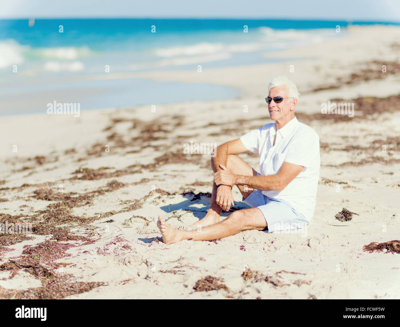 Handsome man on the beach Stock Photo - Alamy
