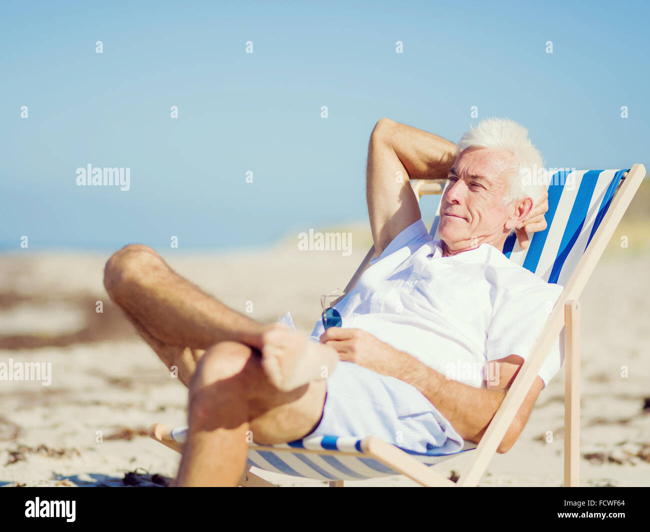 Handsome man on the beach Stock Photo - Alamy