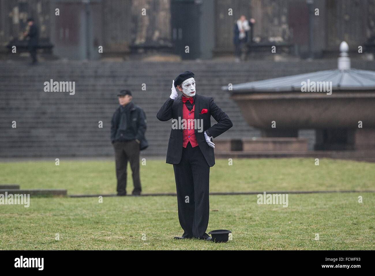 Berlin, Germany. 25th Jan, 2016. A man dressed as a mime gestures in ...