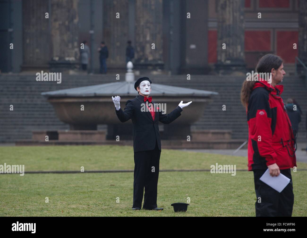Berlin, Germany. 25th Jan, 2016. A man dressed as a mime gestures in ...