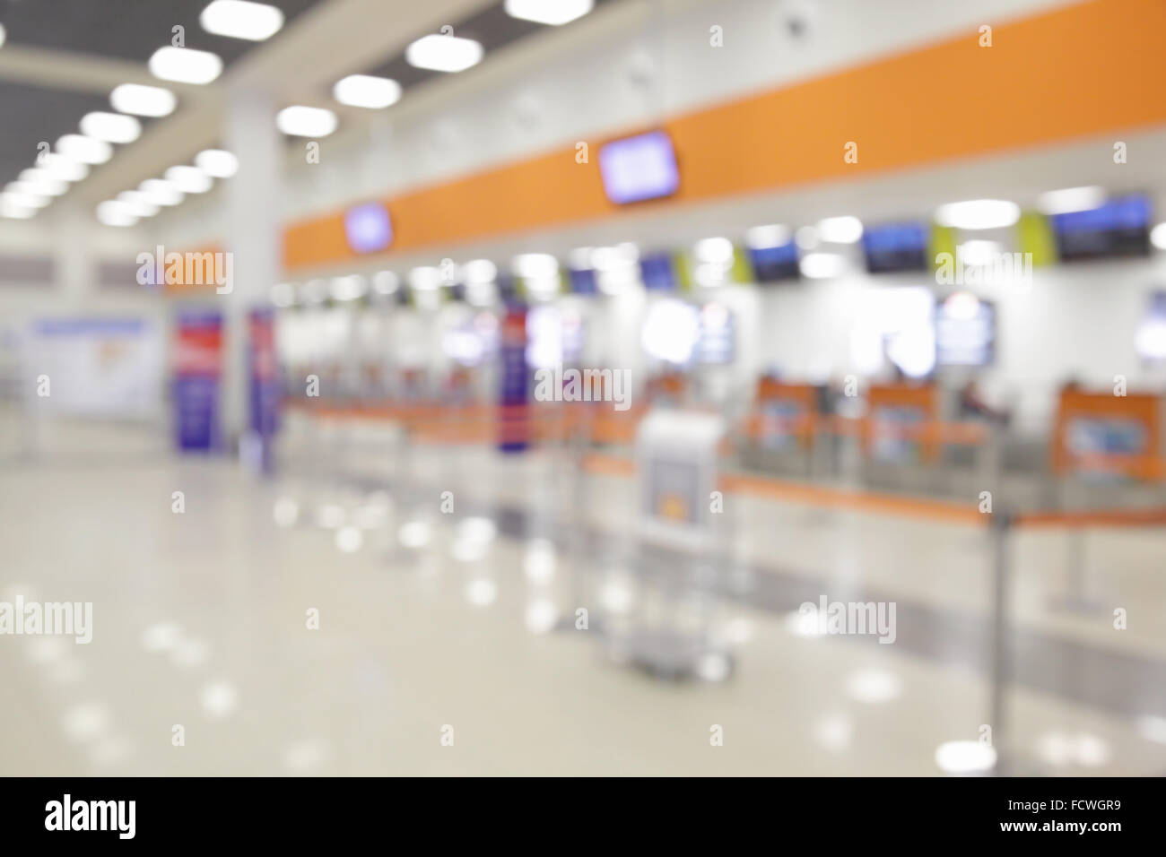 Defocused check-in counters in airport - bokeh background Stock Photo ...