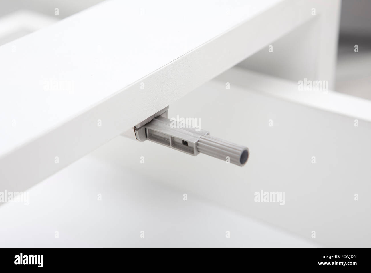 Tip-on handle less opening mechanism - Drawer runners closeup detail ...