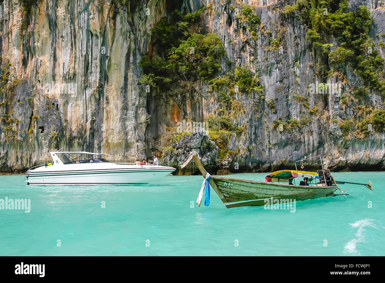 Long-tail boat, speedboat, rocks and sea, Phi Phi island, Thailand ...