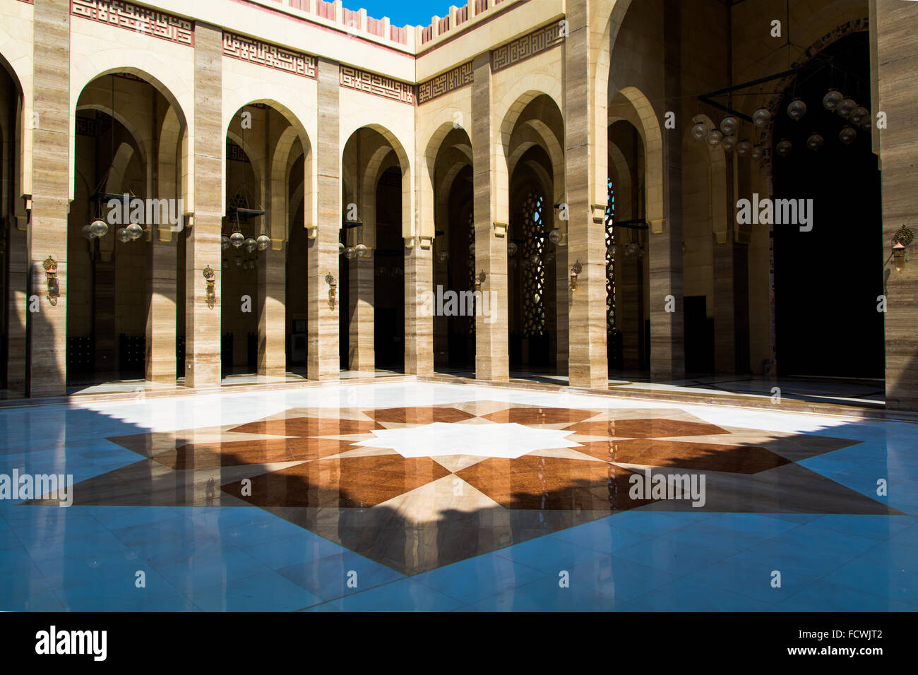 View of Marble Mosque Yard and Columns With Reflections Against Clear ...