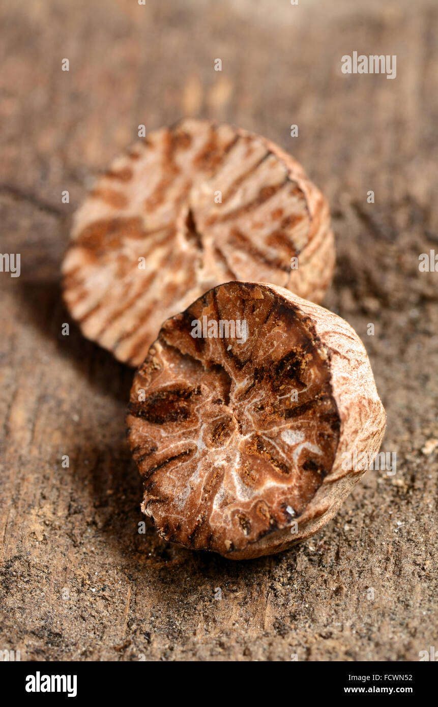 Nutmeg on wooden table shot with a macro lens Stock Photo - Alamy