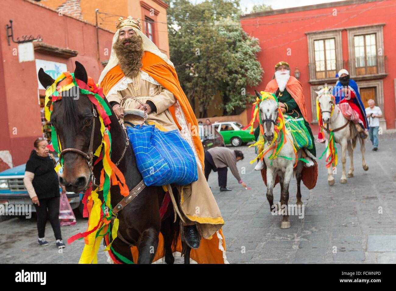 The Three Kings ride by horseback through the cobble streets handing ...