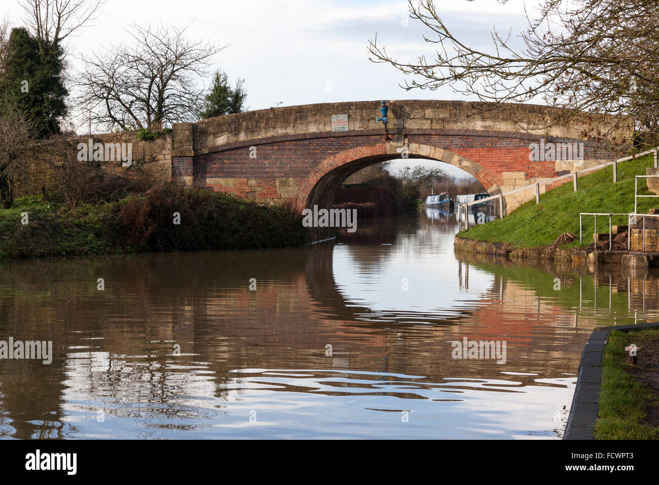 Reflections in the water of the canal bridge on The Kennet and Avon ...