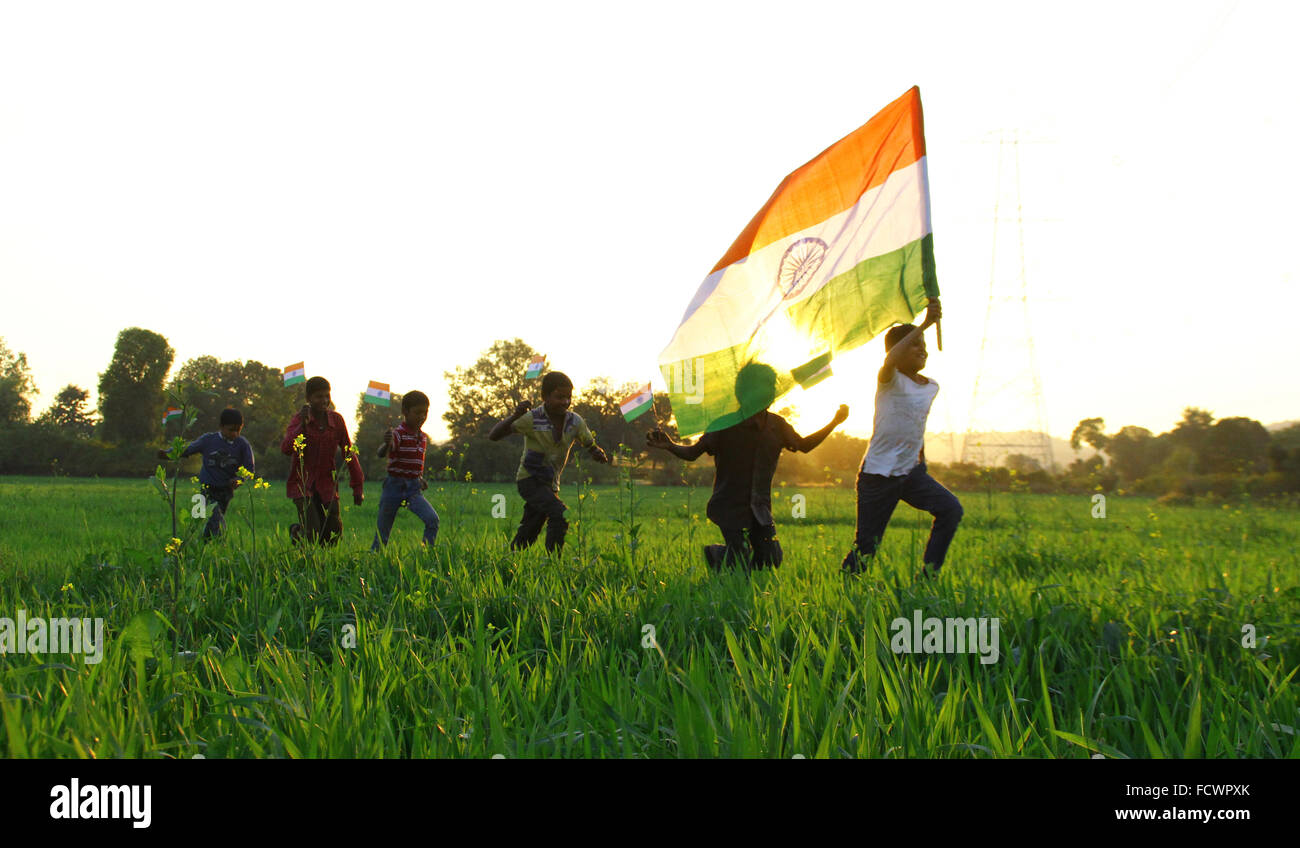 Jabalpur, India. 25th Jan, 2016. Indian children run with the national ...