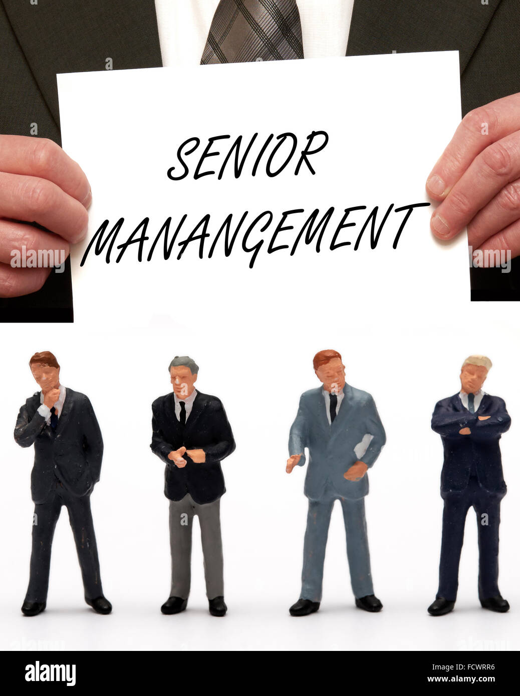 Miniature figurine Business men dressed in suits under the message ...