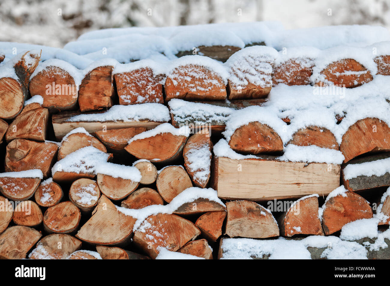 Snow covered firewood stack hi-res stock photography and images - Alamy