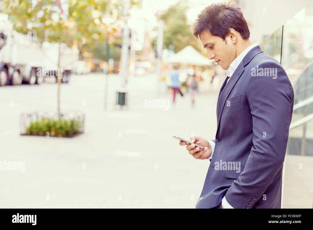 Portrait of confident businessman with his mobile phone outdoors Stock Photo - Alamy