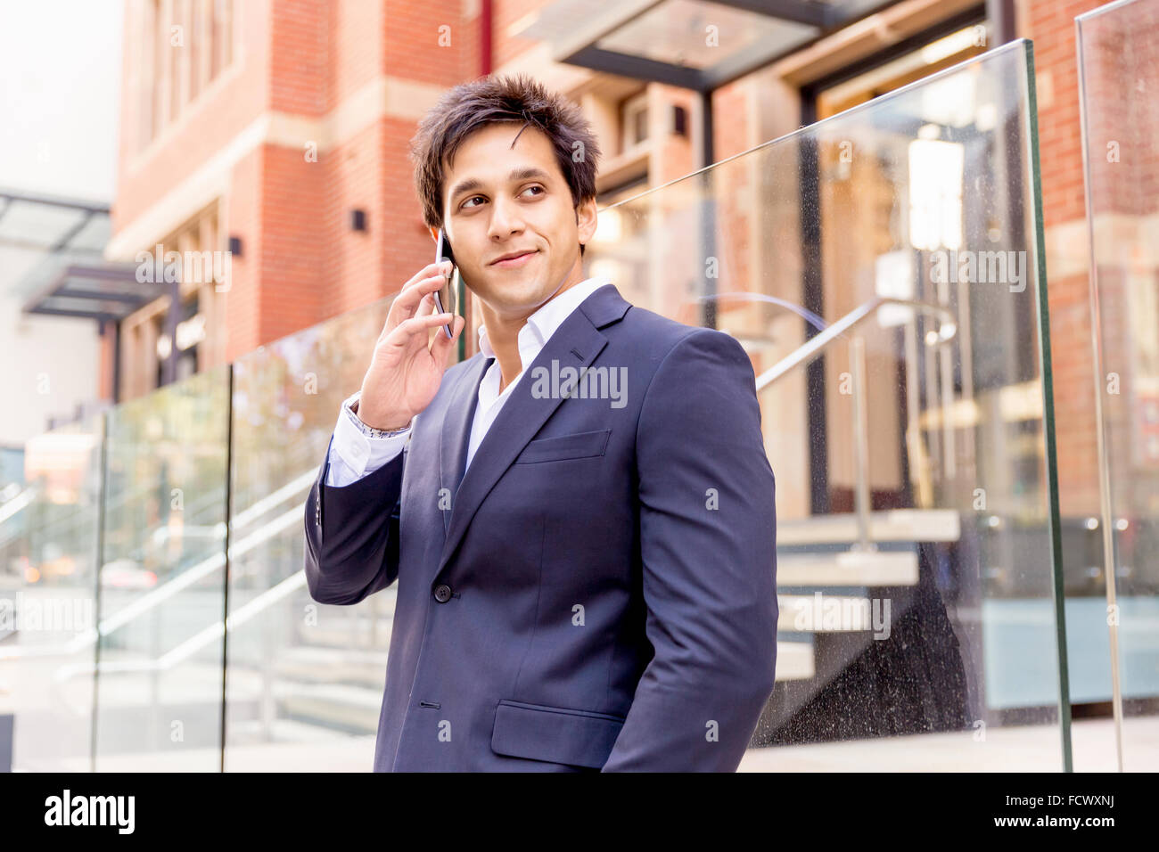 Portrait of confident businessman with his mobile phone outdoors Stock Photo - Alamy