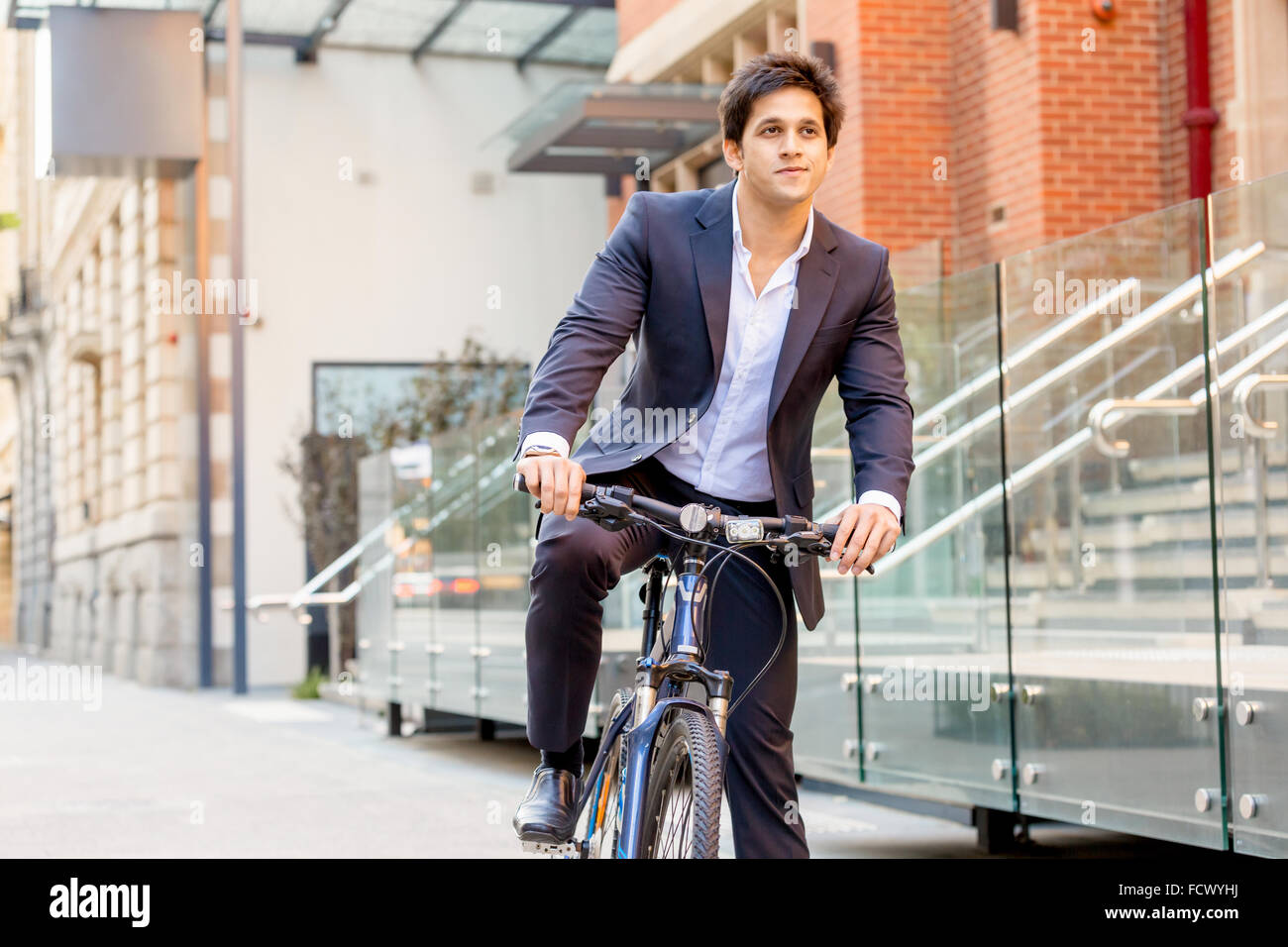 Successful businessman riding bicycle hi-res stock photography and ...