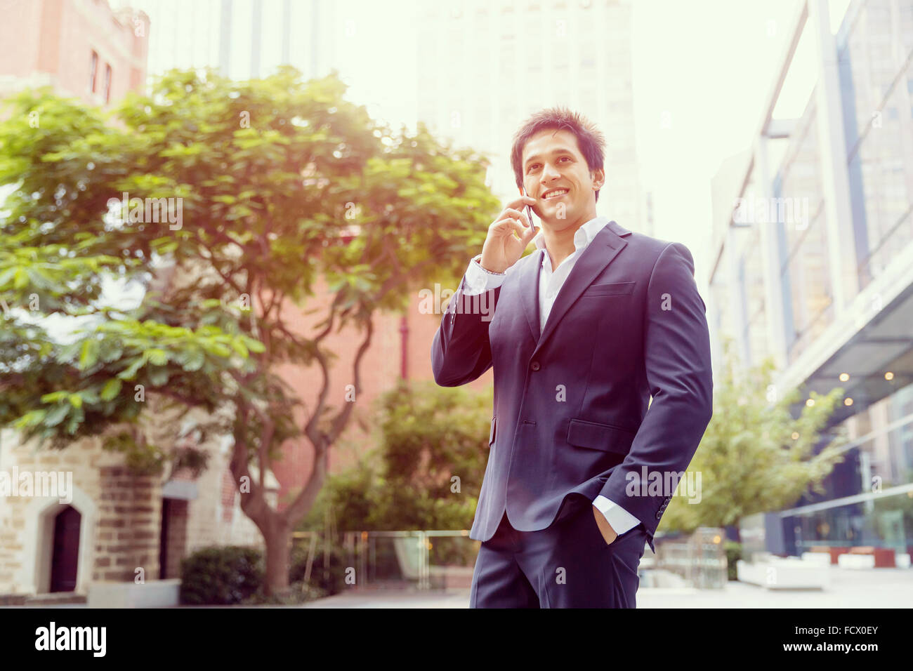 Portrait of confident businessman with his mobile phone outdoors Stock Photo - Alamy