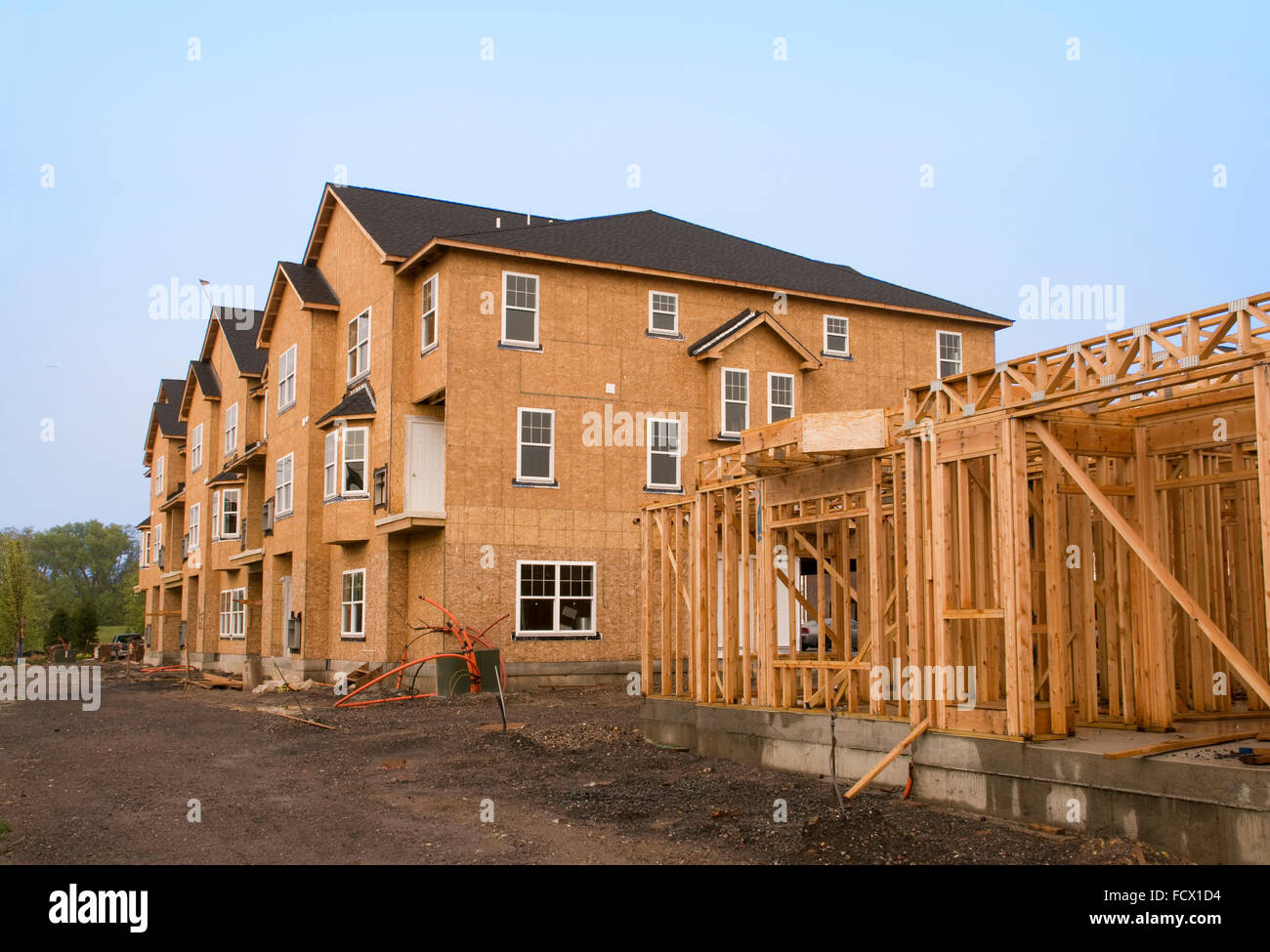 A housing complex under construction in various stages of development ...