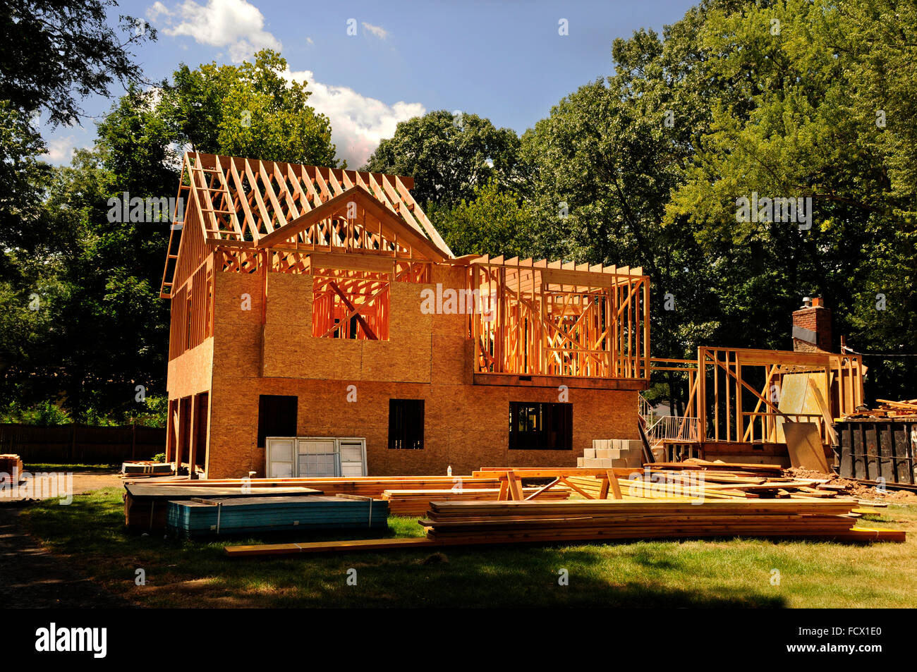 A residential home under construction mid framing and sheathing Stock ...