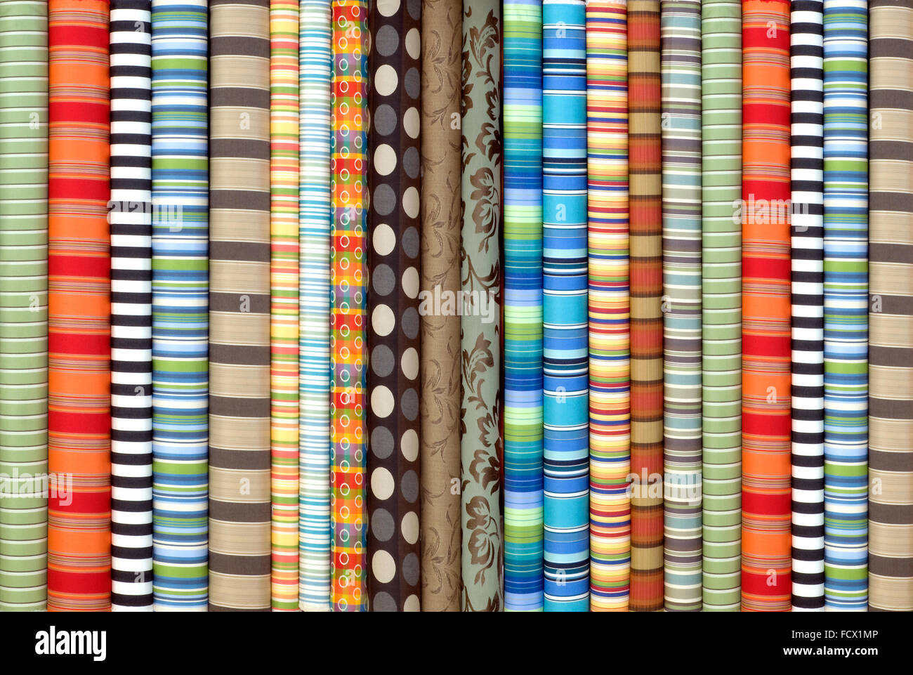 Fabrics in rolls, different design and color Stock Photo - Alamy