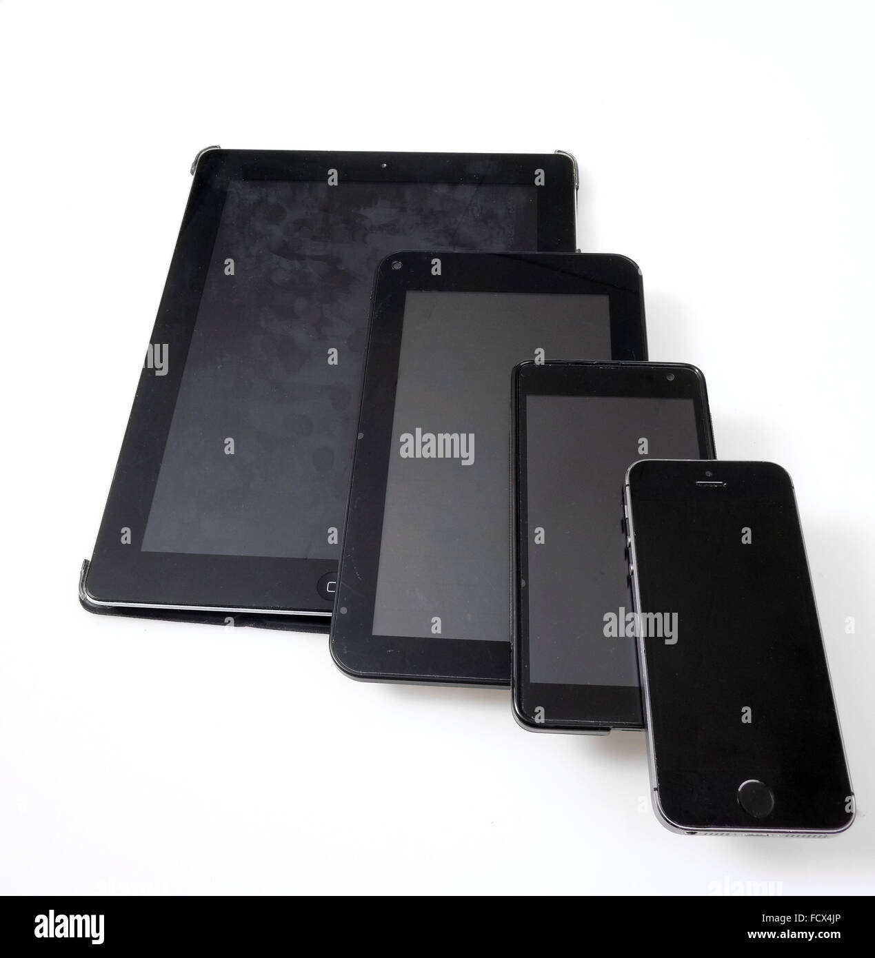 Collection of tablets showing sizes to suit all, ranging from iPhone 5 ...