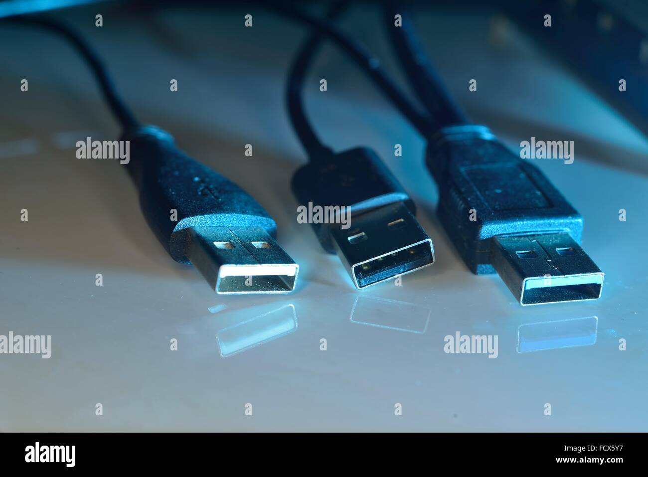 colorful macro zoomed usb connectors on wire on mirror surface Stock ...