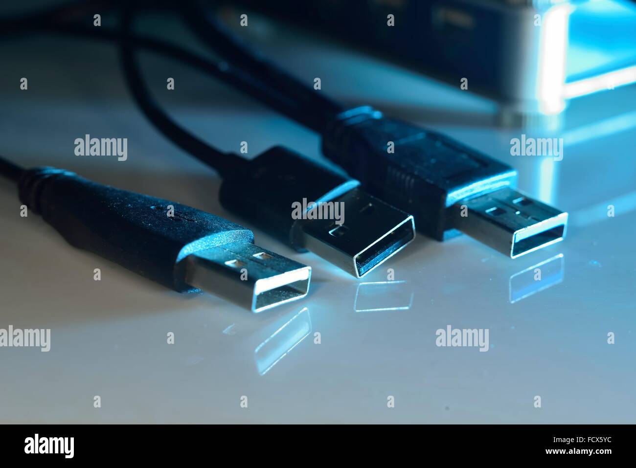colorful macro zoomed usb connectors on wire on mirror surface Stock ...